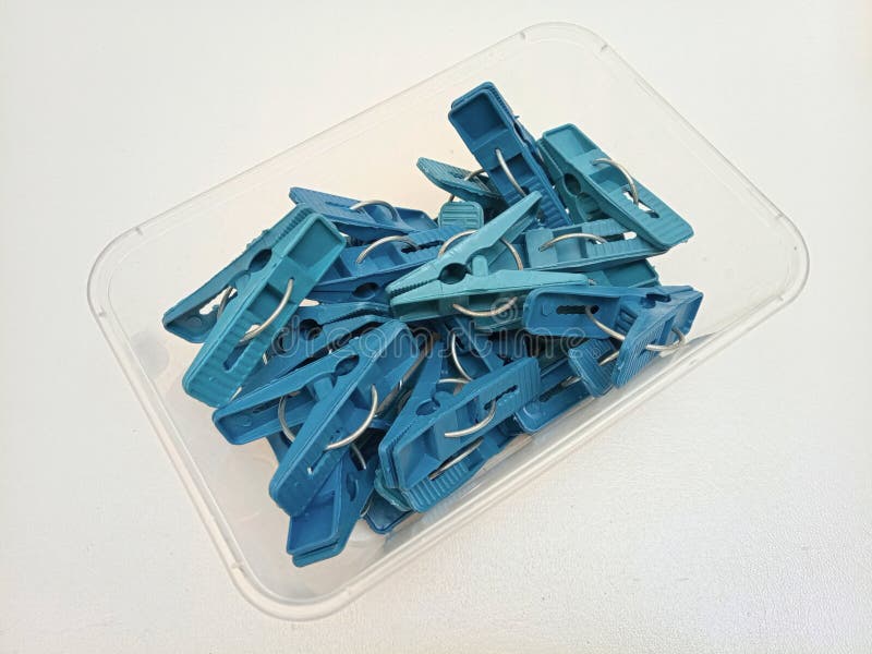 Blue Color Laundry Clips in a Container on the White Background, Multi ...