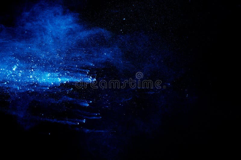Blue Color Powder Explosion Cloud on Black Background. Closeup of Blue ...