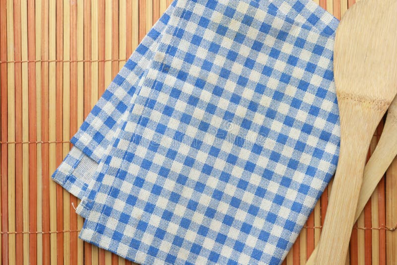 Blue Color Table Napkin and Wooden Spoon on Table Stock Photo - Image ...