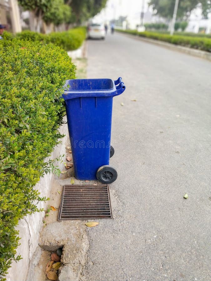 Blue Colored Dustbin at Roadside To Keep City Clean Stock Photo - Image ...