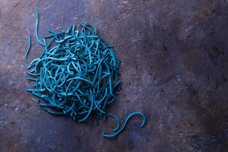 Blue Colored Pasta on Dark Background Left. Flat Lay. Copy Space. Top ...