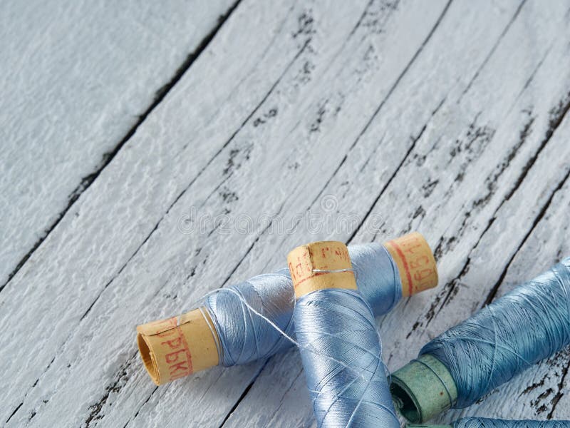 Blue and Colored Silk Threads on Paper Sleeves.Vintage Threads Lie on a ...