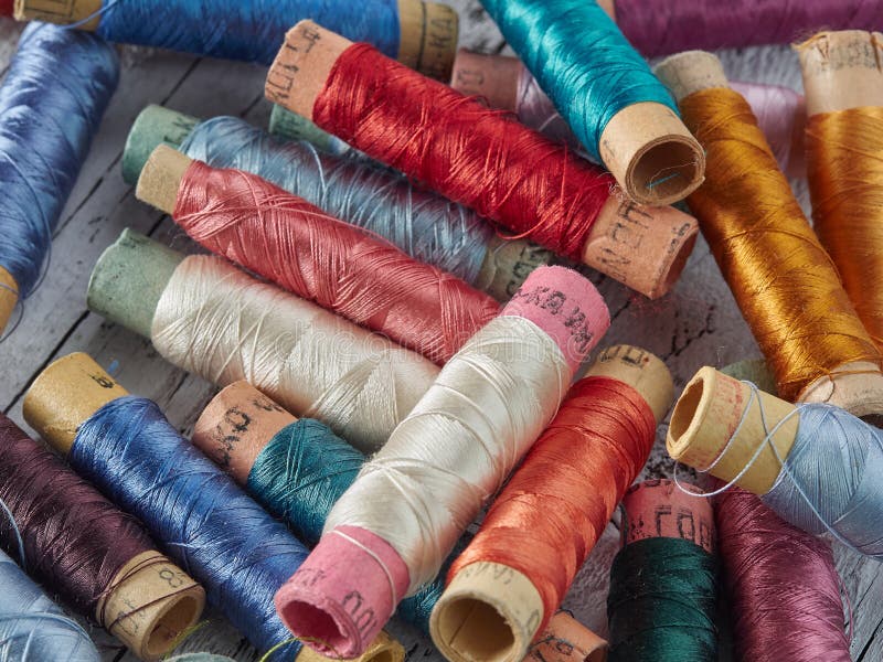 Blue and Colored Silk Threads on Paper Sleeves.Vintage Threads Lie on a ...