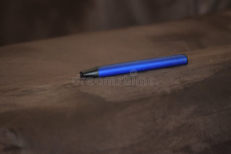 Blue Coloured Vape Smocking Device Stock Photo - Image of hand, glasses ...