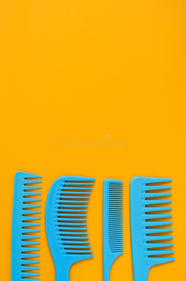 Blue Combs on a Yellow Background. Copy Space Stock Image - Image of ...