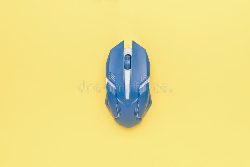 A Blue Computer Mouse on a Yellow Background Stock Image - Image of ...