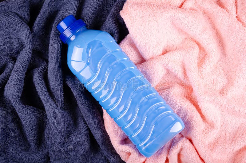 Blue Conditioner in Bottle on Textile Composition Stock Image - Image ...