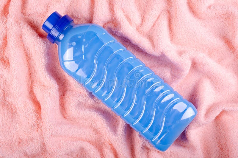 Blue Conditioner in Bottle on Textile Composition Stock Image - Image ...