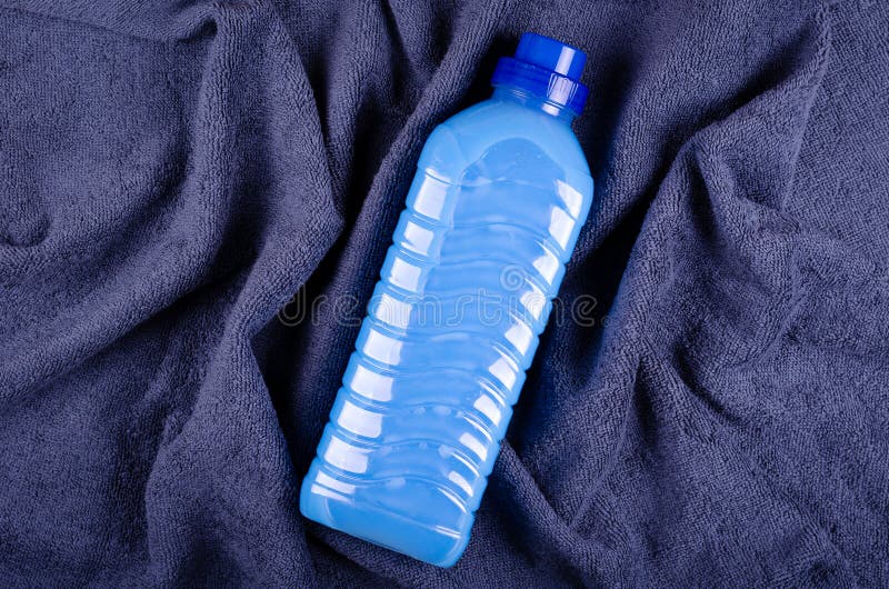 Blue Conditioner in Bottle on Textile Composition Stock Photo - Image ...