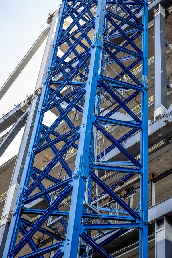 Blue Construction Crane Tower and Framework with Building in Background ...