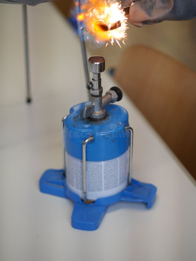 Blue Container with a Flame on Top of it Stock Image - Image of flask ...