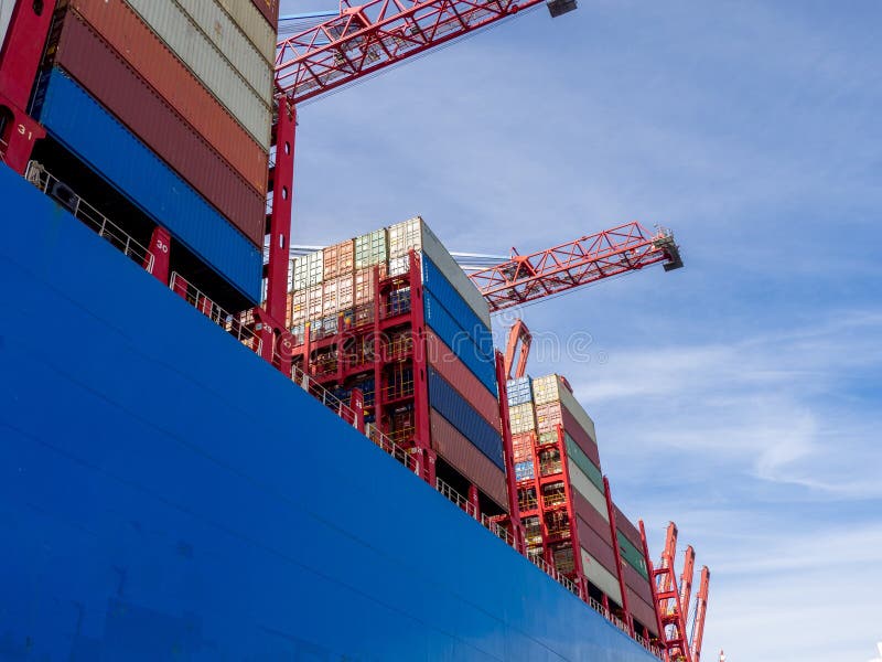On Blue Container Ship There are Many Stacked Industrial Containers ...
