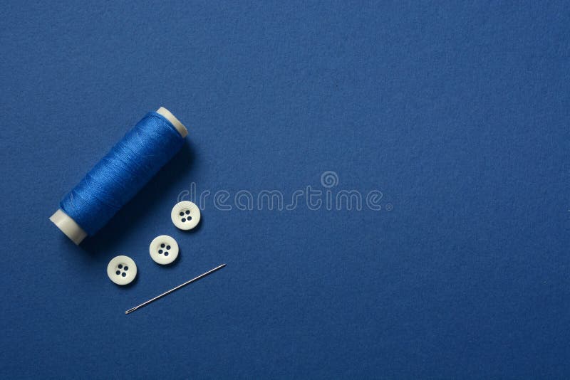 Blue Cotton Thread, Sewing Buttons and Tailor Needle - Blue Back Stock ...