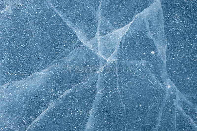 Blue cracked ice with snow stock photo. Image of season - 188732188