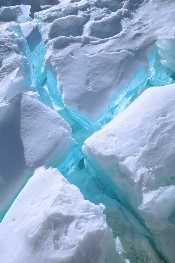 Blue Ice and Cracks on the Surface of the Ice. Frozen Lake Under a Blue ...