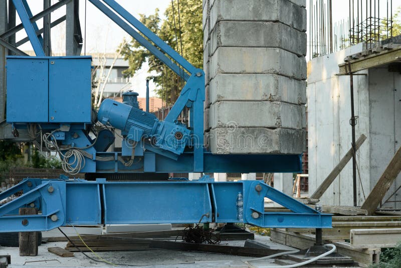 Blue Crane Base and Concrete Counterweights on Construction Site Stock ...