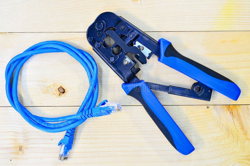 Blue Crimping Tool with a Computer Network Cable Stock Photo - Image of ...