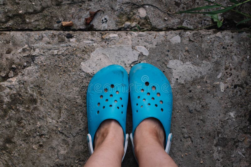 Blue crocs on the legs stock image. Image of girl, footwear - 254774989