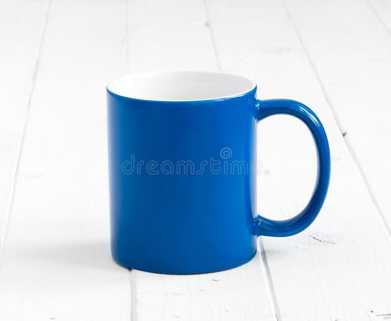 Blue Cup with White Inside on Wooden Table Stock Image - Image of ...