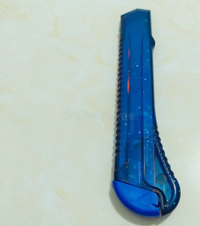 Blue Cutter Knife on the Floor Stock Image - Image of floor, blue ...