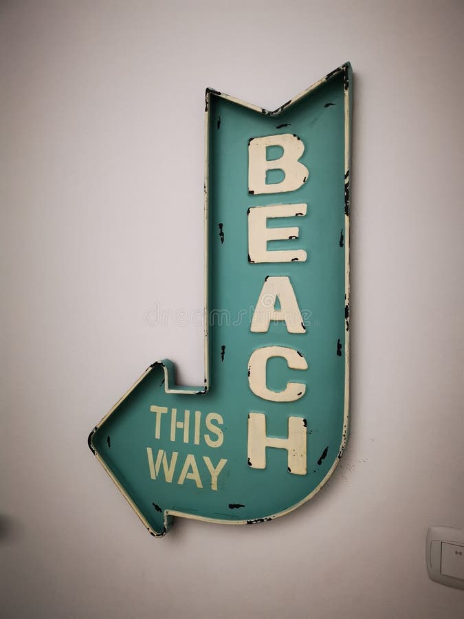 A Blue Decorative Post Sign Beach this Way Hanging on the White Wall ...