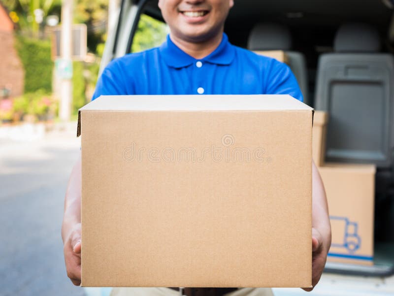 Blue Delivery Man Holding Parcel Cardboard Box Stock Photo - Image of ...