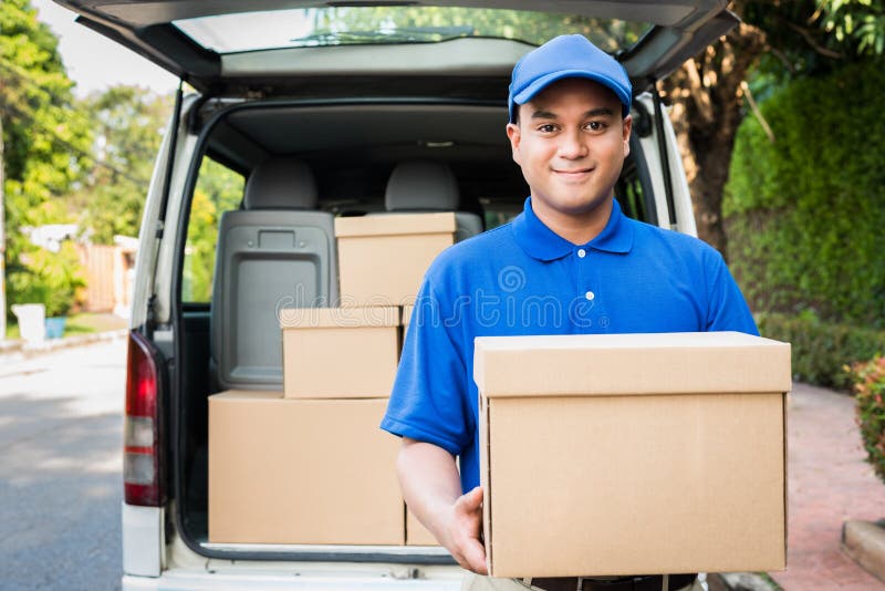 Blue Delivery Man Holding Parcel Cardboard Box Stock Photo - Image of ...