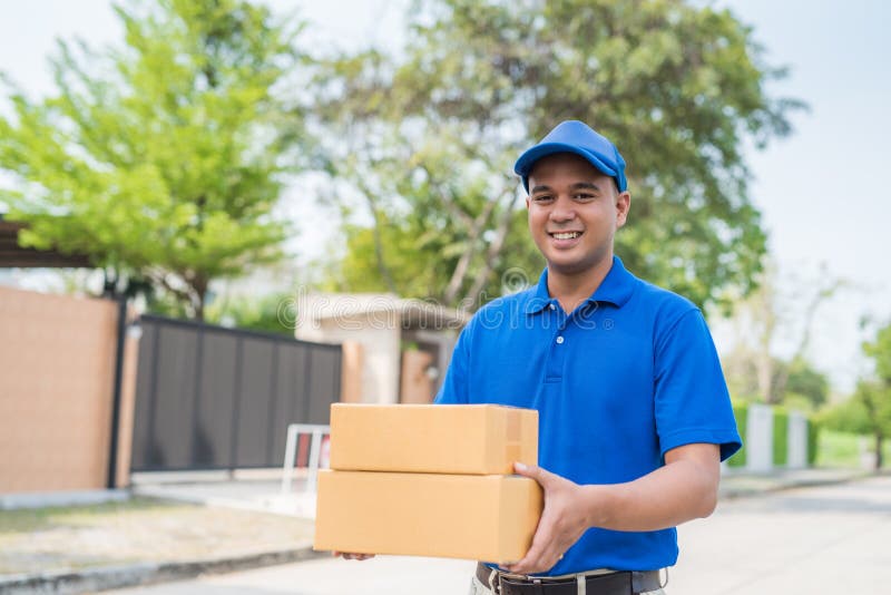 Blue Delivery Man Pick Up the Parcel Cardboard Box in the Truck Stock ...