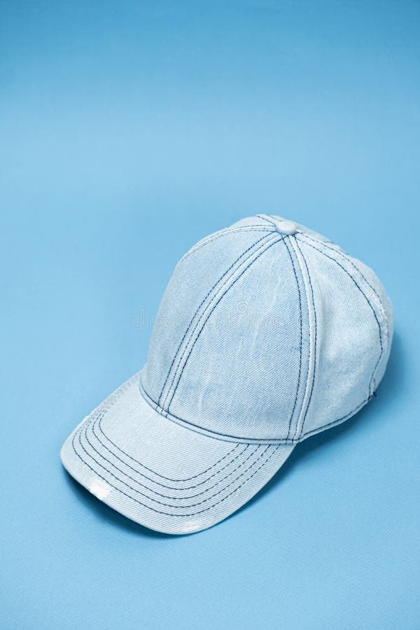 Blue Denim Cap Close-up on Blue Background. Stock Image - Image of ...