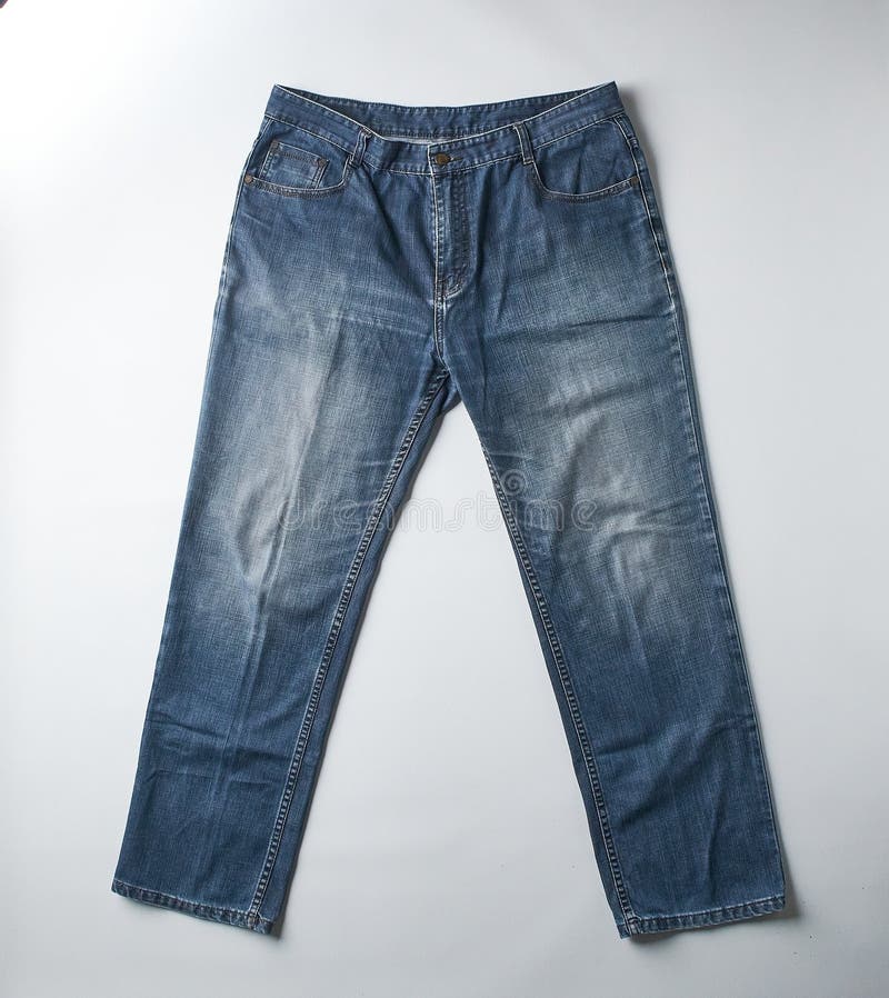Denim Jeans Laid Flat on a Light Background Showcasing Wear Patterns ...