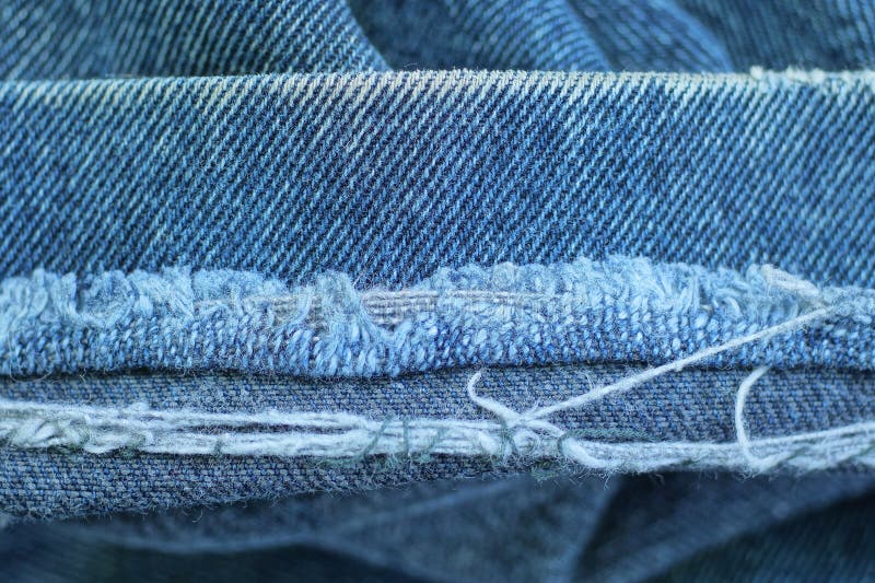 Blue Denim Pants with White Threads on Torn Fabric Stock Image - Image ...