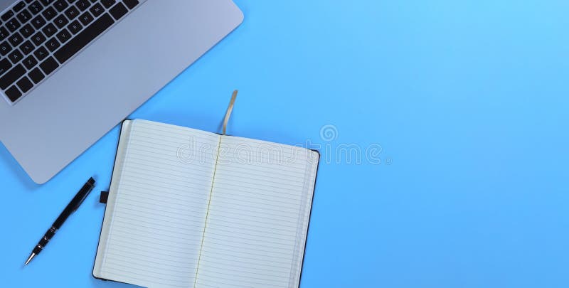 Blue Desktop with Writing Paper, Pen, and Laptop Computer Stock Image ...