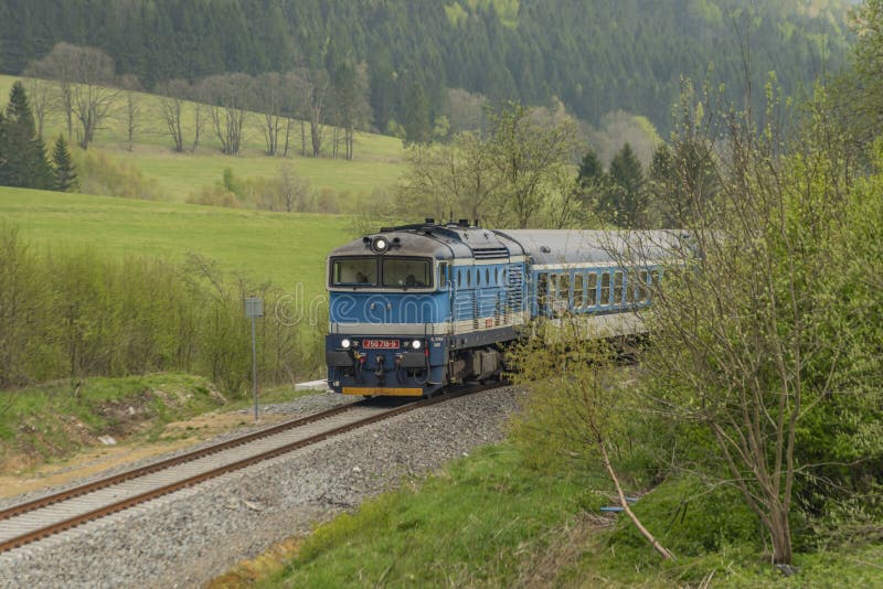 Blue Diesel Train with Passengers Coach in Jeseniky Mountains Editorial ...