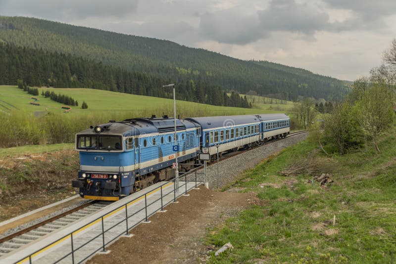 Blue Diesel Train with Passengers Coach in Jeseniky Mountains Editorial ...