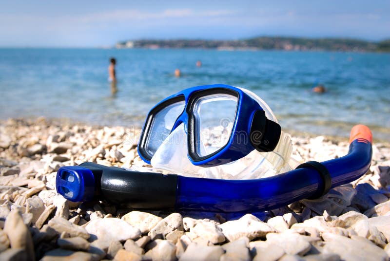 Blue Diving Goggles on Sea Beach Stock Photo - Image of scuba ...