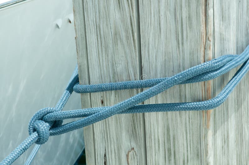 Blue Nylon, Docking Line, Tied To Dock with a Bowline Knot Stock Image ...