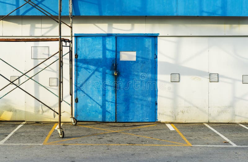 Blue Door with Warehouse Closeup and Shadow Stock Image - Image of door ...