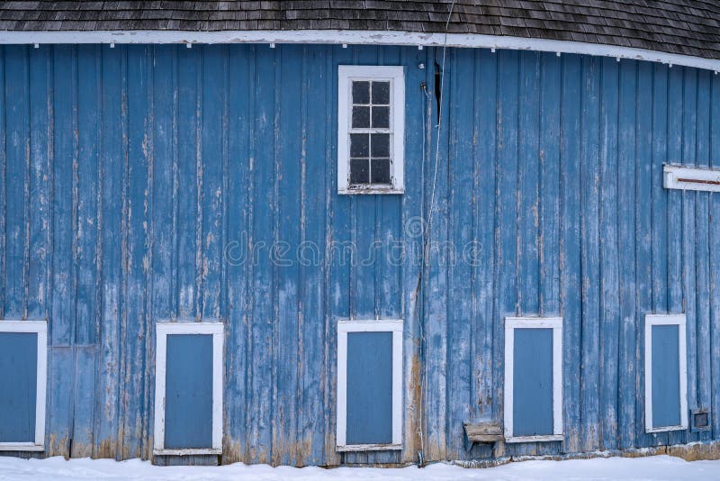 Blue Doors and Windows on the Side of a Rustic Round Barn Stock Image ...
