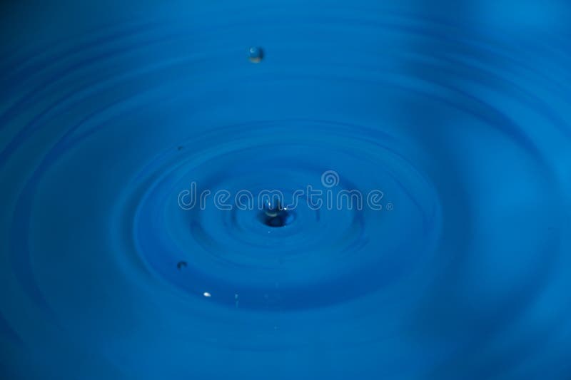 Blue Drop of Water Splashing Stock Image - Image of ripple, motion ...