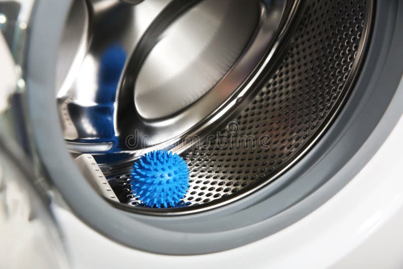 Blue Dryer Ball in Washing Machine Drum, Closeup Stock Image - Image of ...