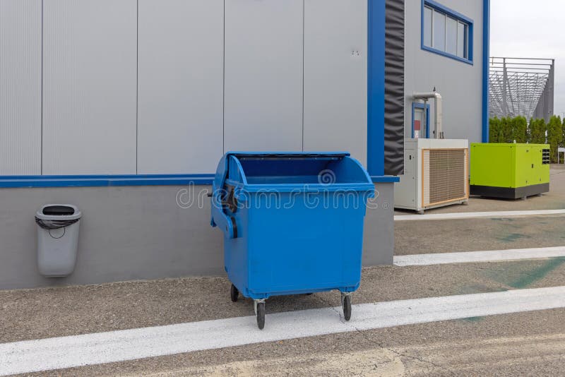 Blue Dumpster Warehouse stock photo. Image of wall, open - 239973084