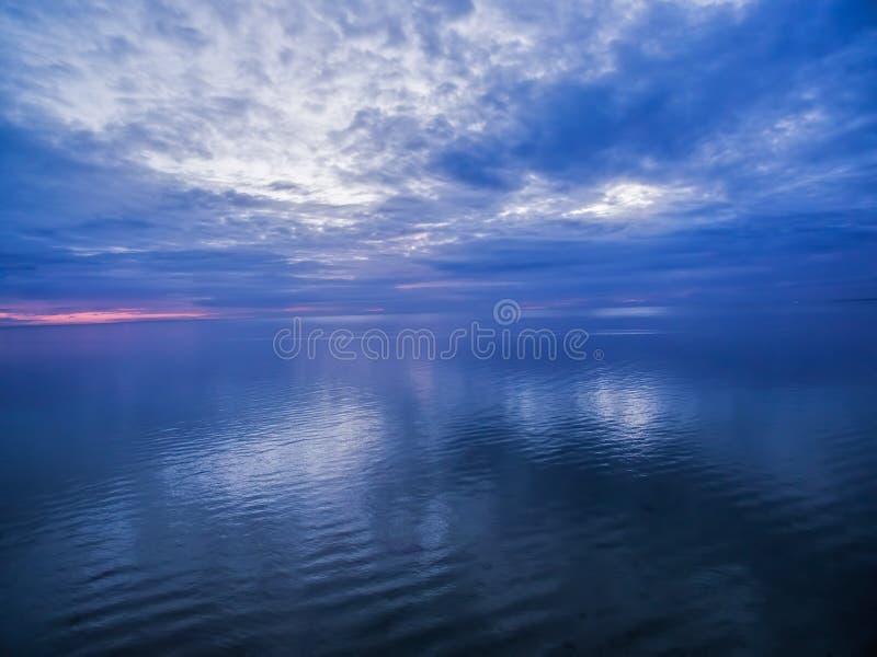 Blue dusk over ocean stock photo. Image of moody, seascape - 73840378
