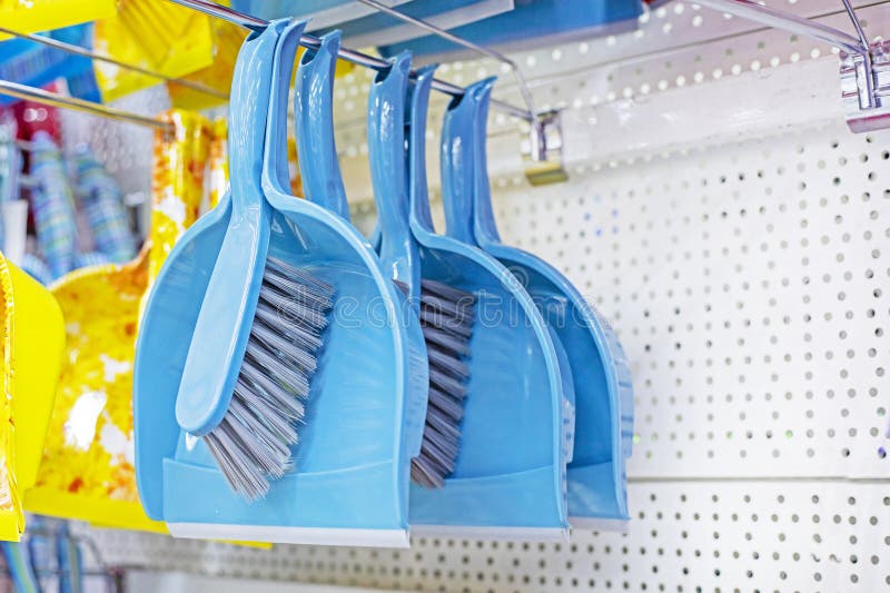 Blue Dustpan and Broom Sets for Cleaning in a Supermarket Display Case ...