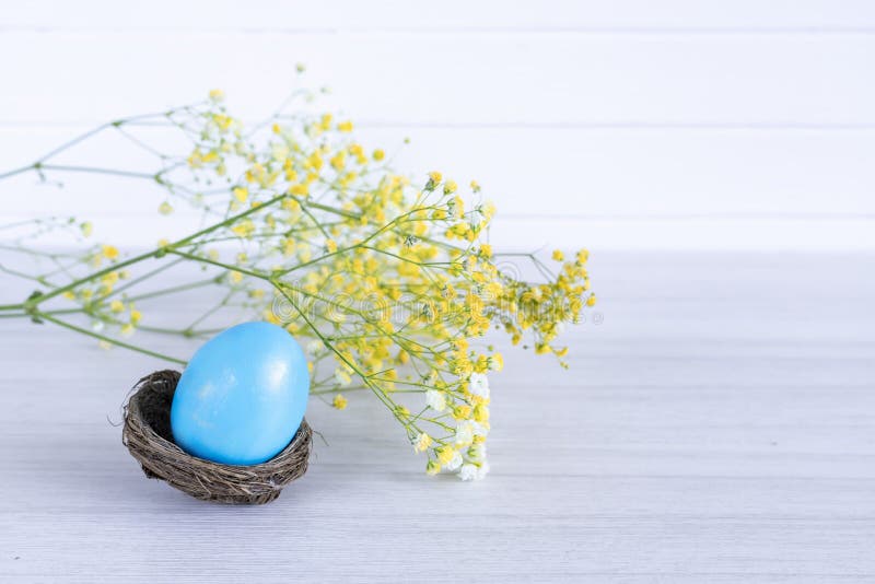 Blue Easter Egg with Flowers on Table Stock Image - Image of quail ...