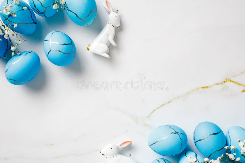 Blue Easter Eggs with Rabbits and Spring Flowers on Marble Table Stock ...