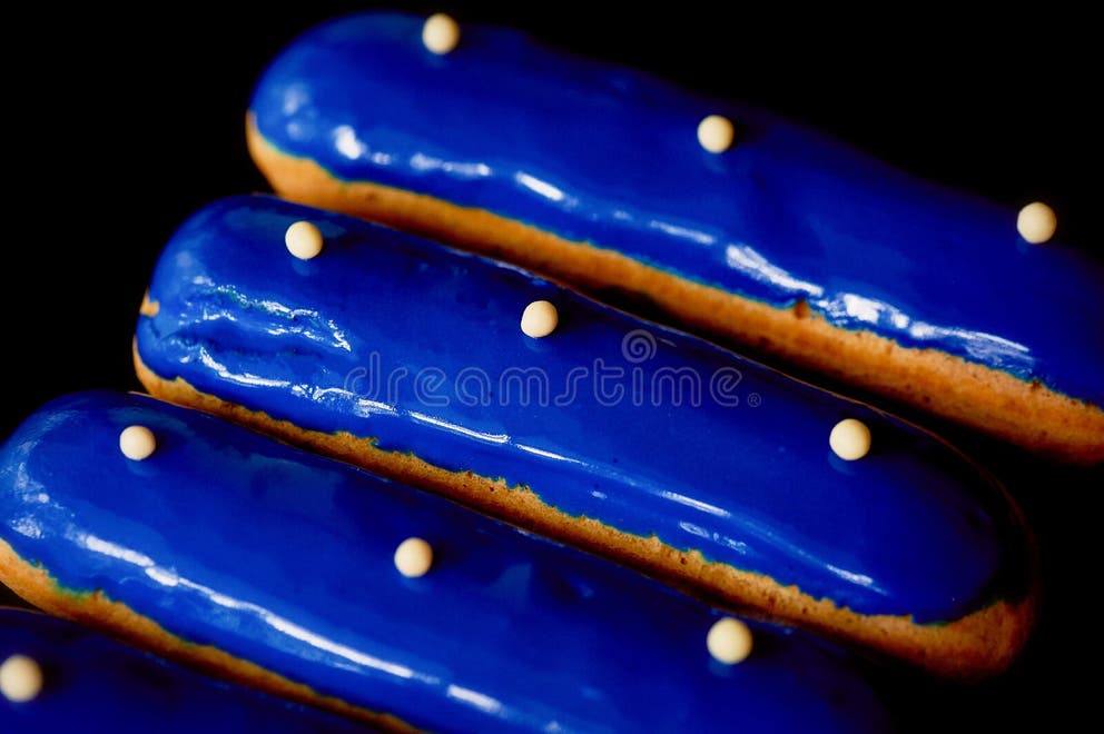 Blue Eclairs with a Mirrored Glaze.a Work of Culinary Art. Cakes Stock ...