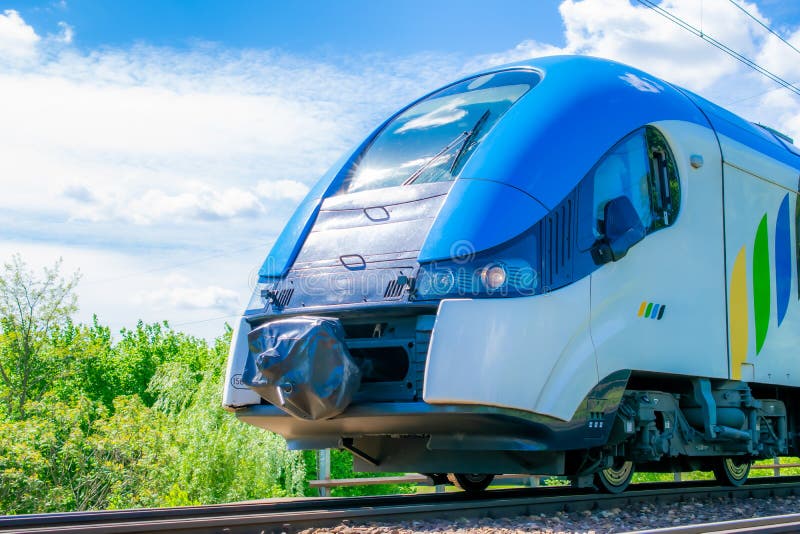 Blue Eco Train on the Tracks Editorial Stock Image - Image of track ...