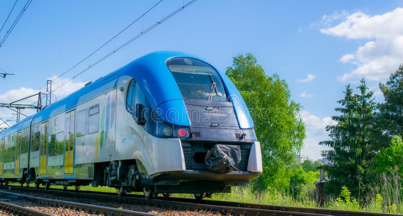 Blue Eco Train on the Tracks Stock Image - Image of station, blue ...