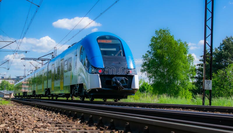 Blue Eco Train on the Tracks Stock Image - Image of station, blue ...