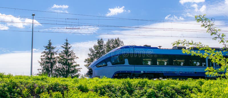Blue Eco Train on the Tracks Stock Image - Image of urban, railway ...
